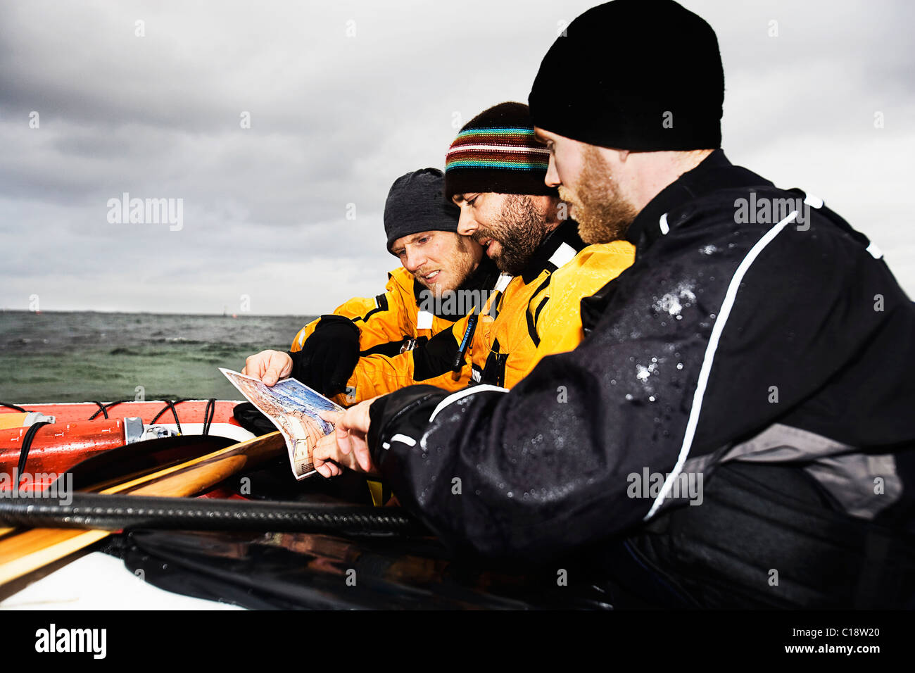 3 young people looking at map hi-res stock photography and images - Alamy