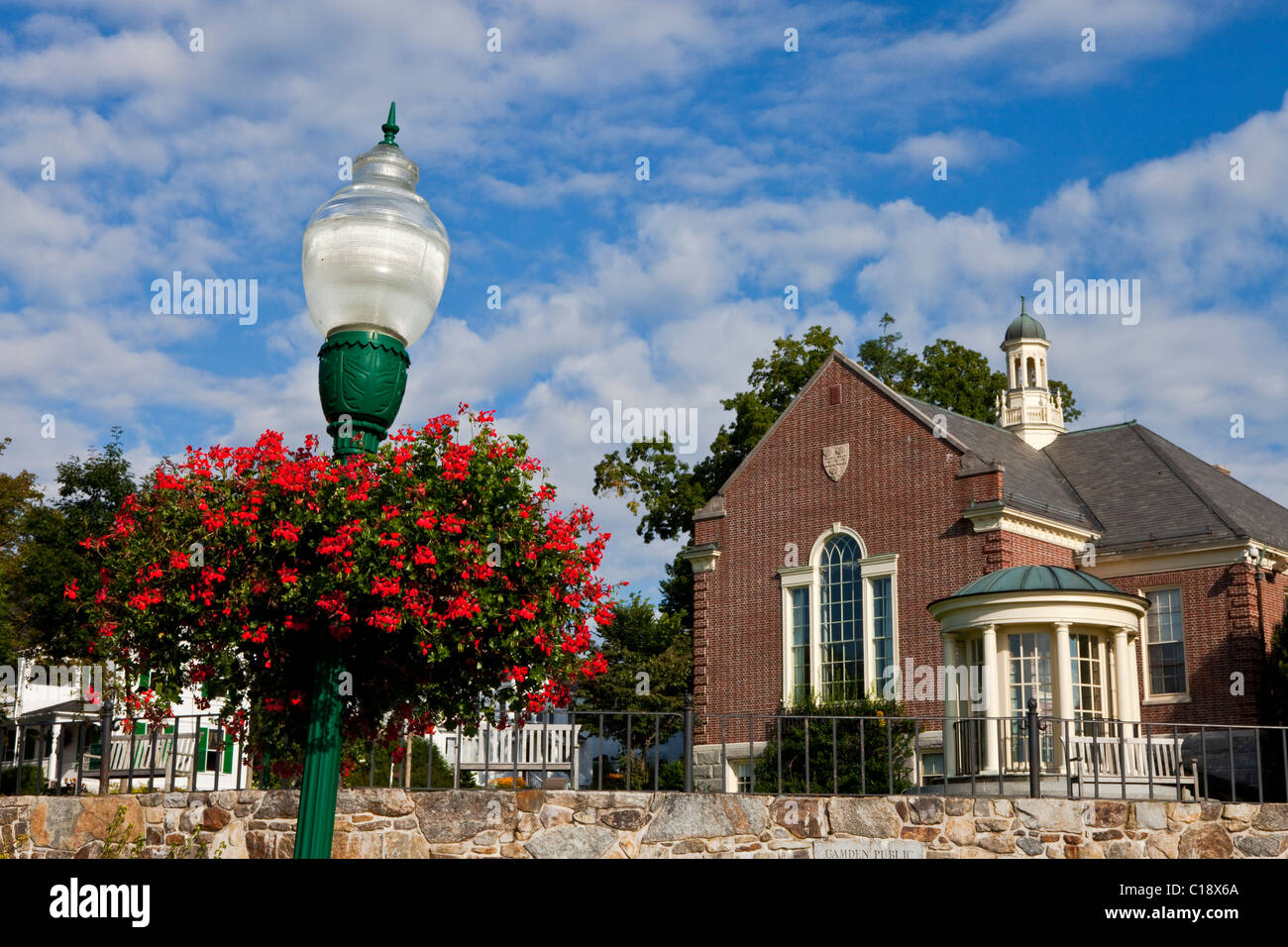 Camden Maine public library and red flowers on a lamppost Stock Photo ...