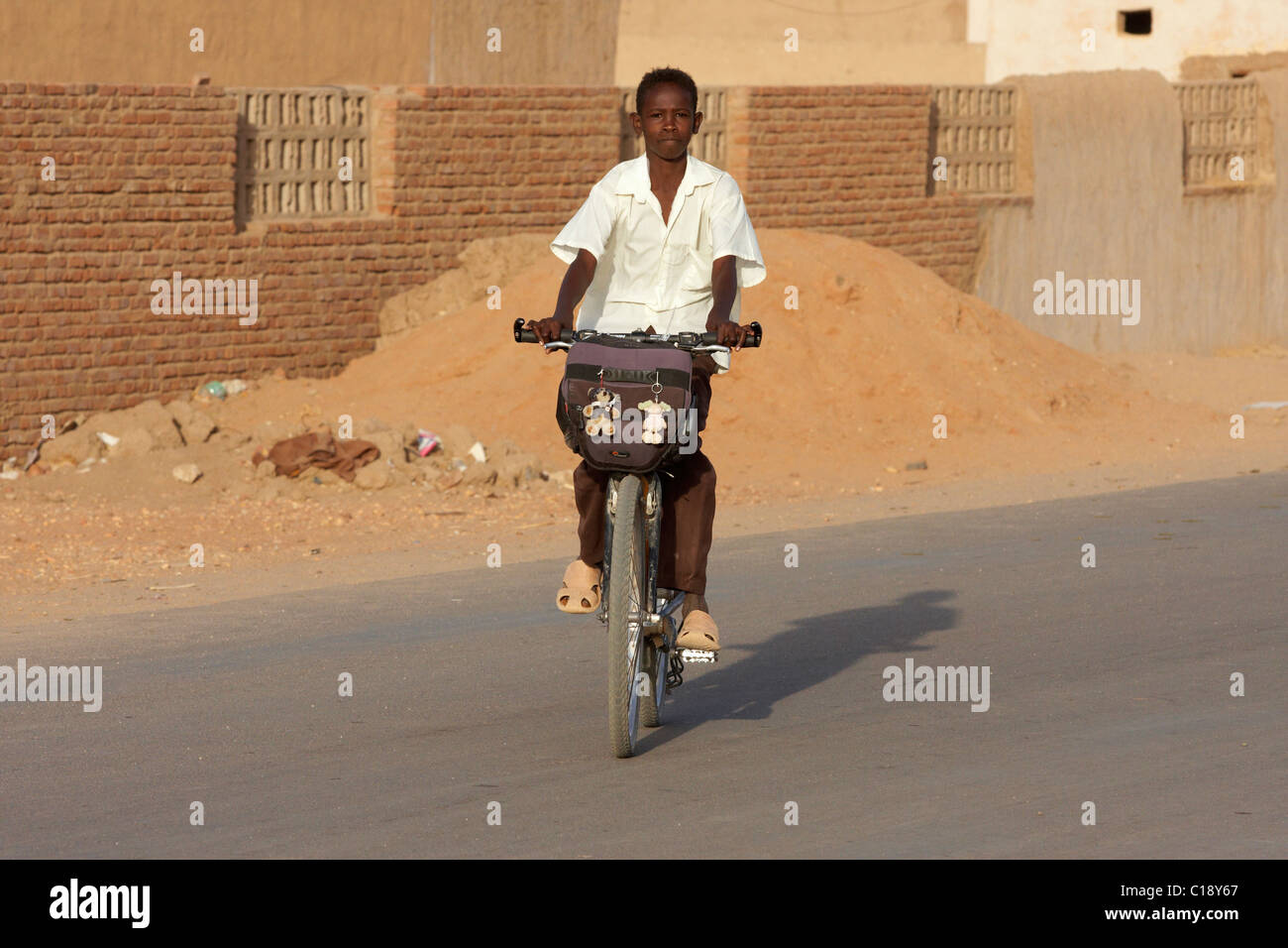 African boy riding a bicycle hi-res stock photography and images - Alamy