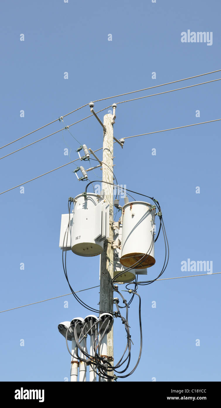 Electrical transformer against a bright blue sky Stock Photo - Alamy
