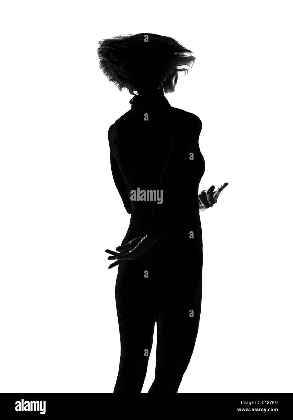woman in shadow silhouette full length in studio isolated white ...