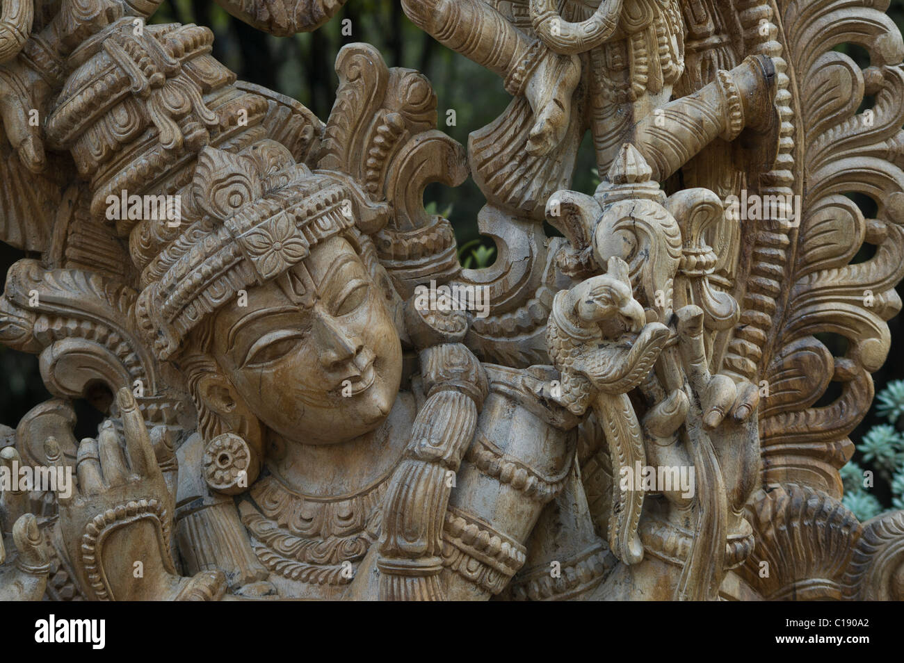 Close up of a wooden carving of an Indian Goddess at a handicrafts ...