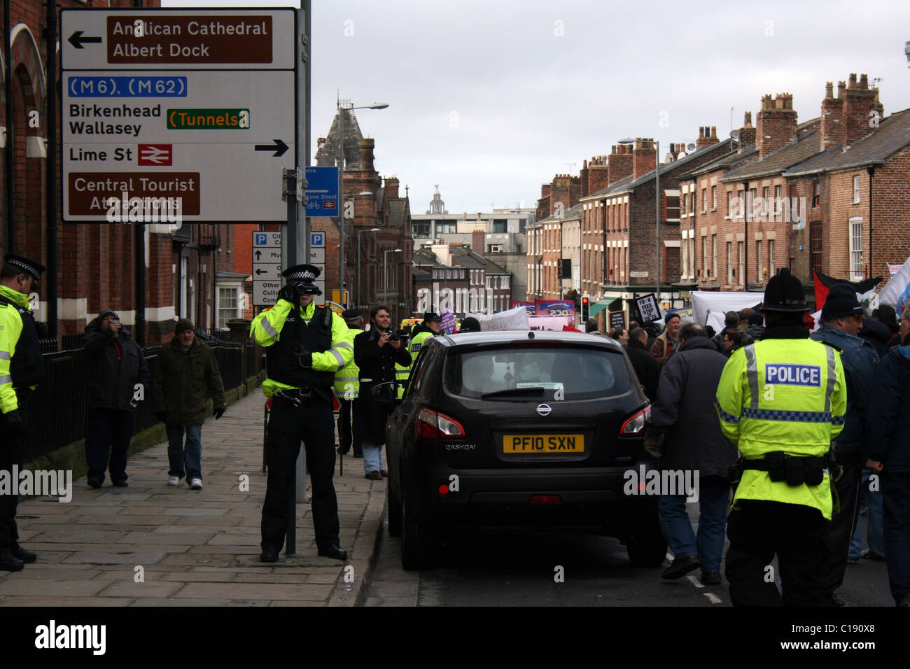 Protesters march against government cuts in Liverpool 11th December ...