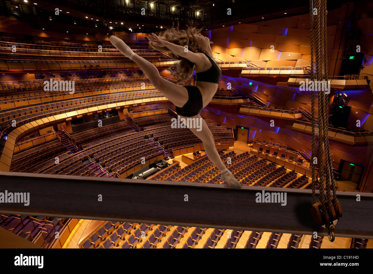 Ballet Dancer jumping on I-Beam above Theater Stock Photo - Alamy