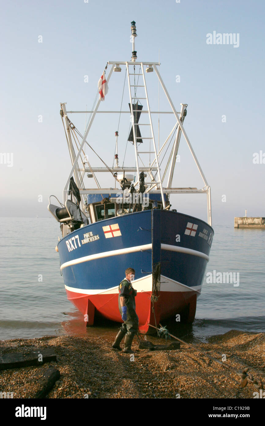 brightly coloured fishing boats on the beach at hastings Stock Photo ...