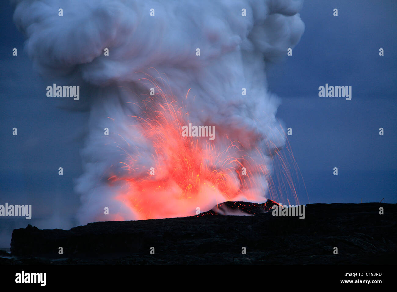 Explosions in the spouts of smoke and steam of the active lava flow on ...