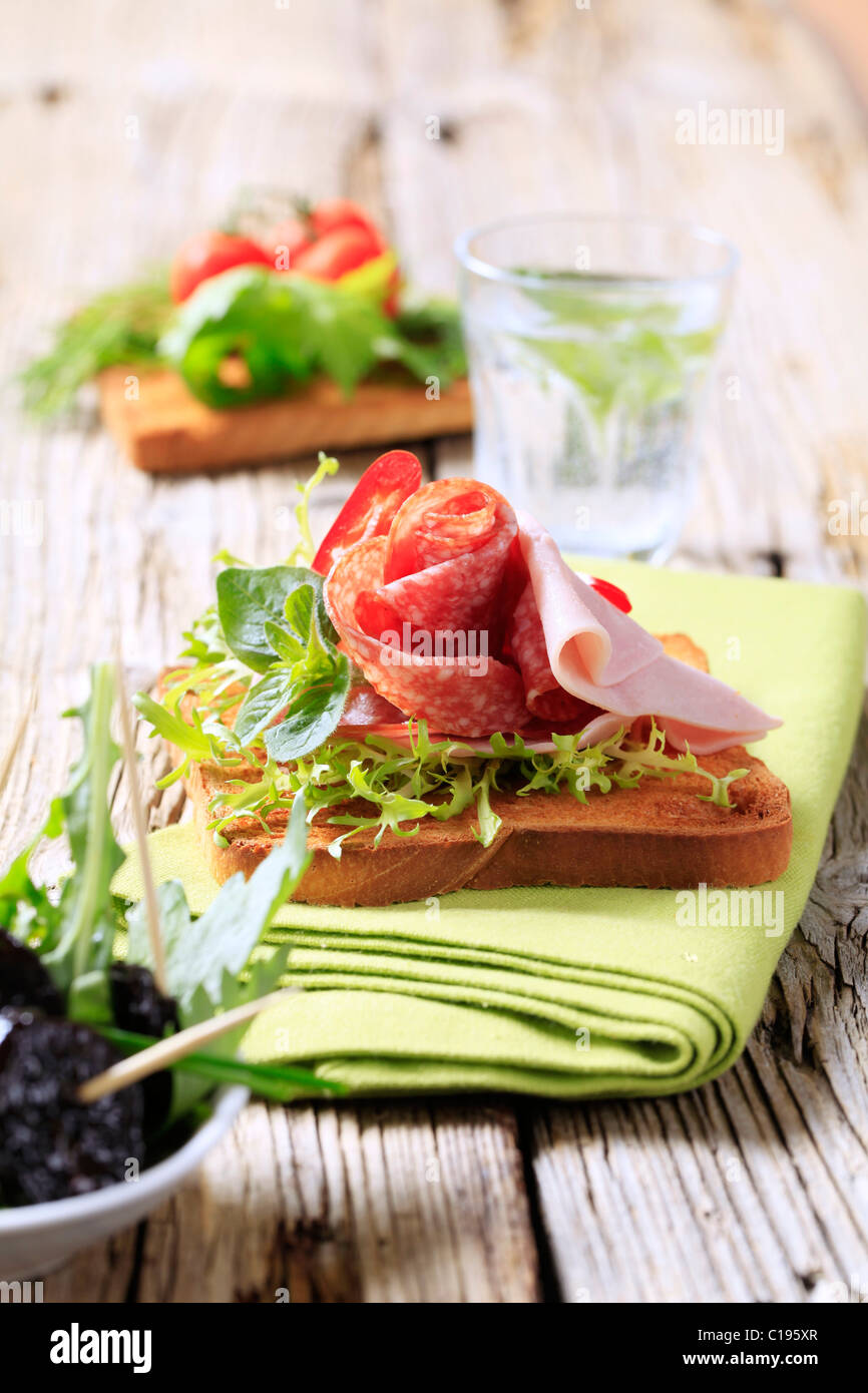 Toast with ham and vegetable topping - closeup Stock Photo - Alamy