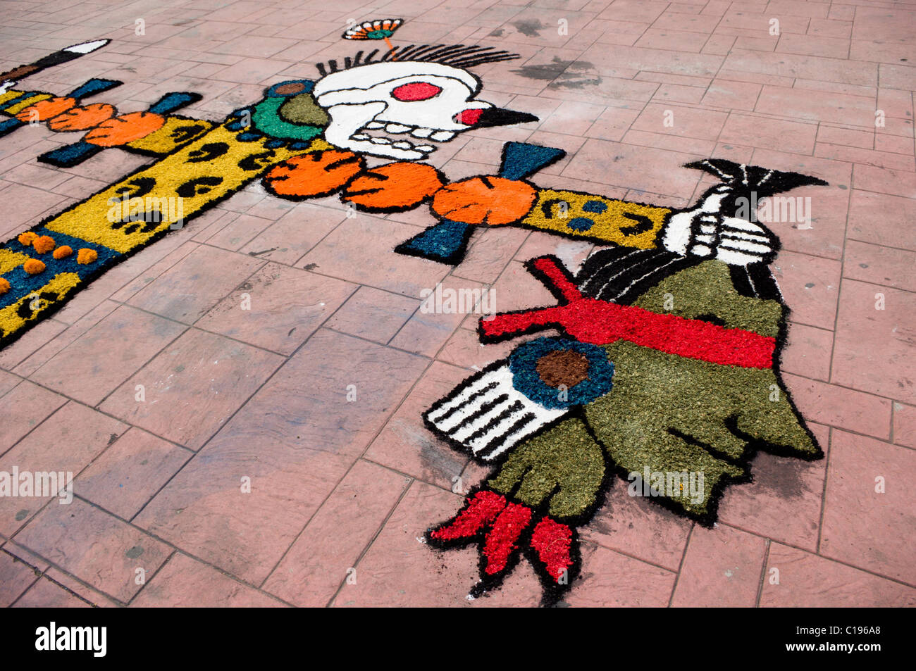 Drawing made with colored sand and flowers representing an Aztec ...