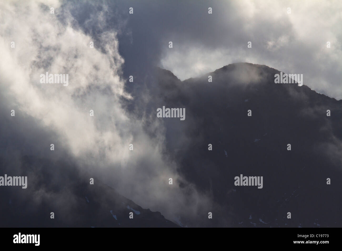 Clouds swirling around the ridges of Snowdon, Snowdonia National Park ...