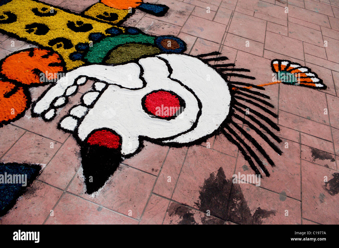 Drawing made with colored sand and flowers representing an Aztec ...