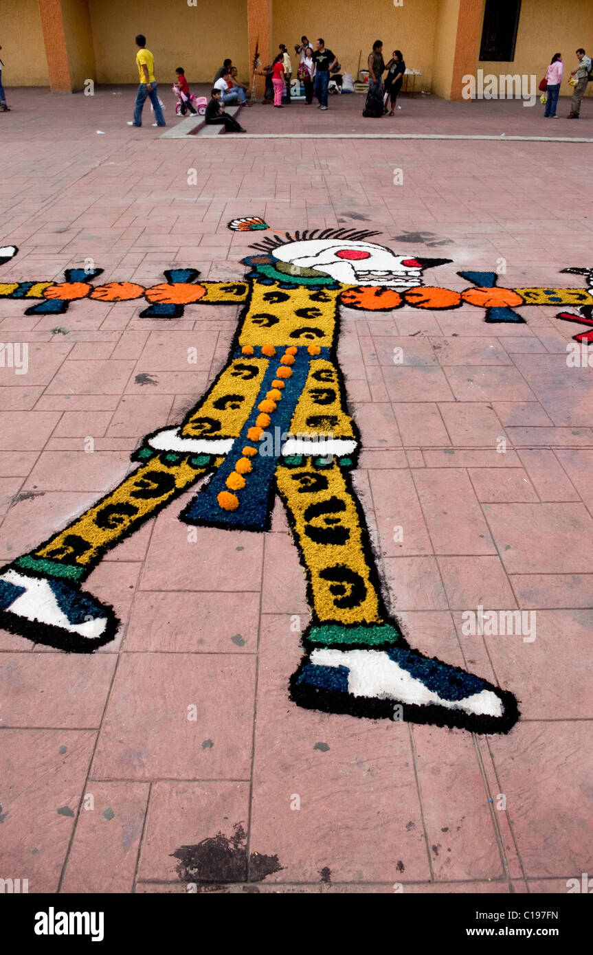 Drawing made with colored sand and flowers representing an Aztec ...