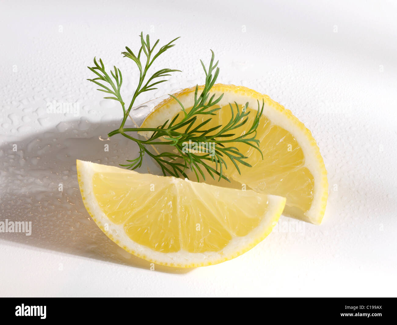 Lemon wedges with Dill Stock Photo - Alamy