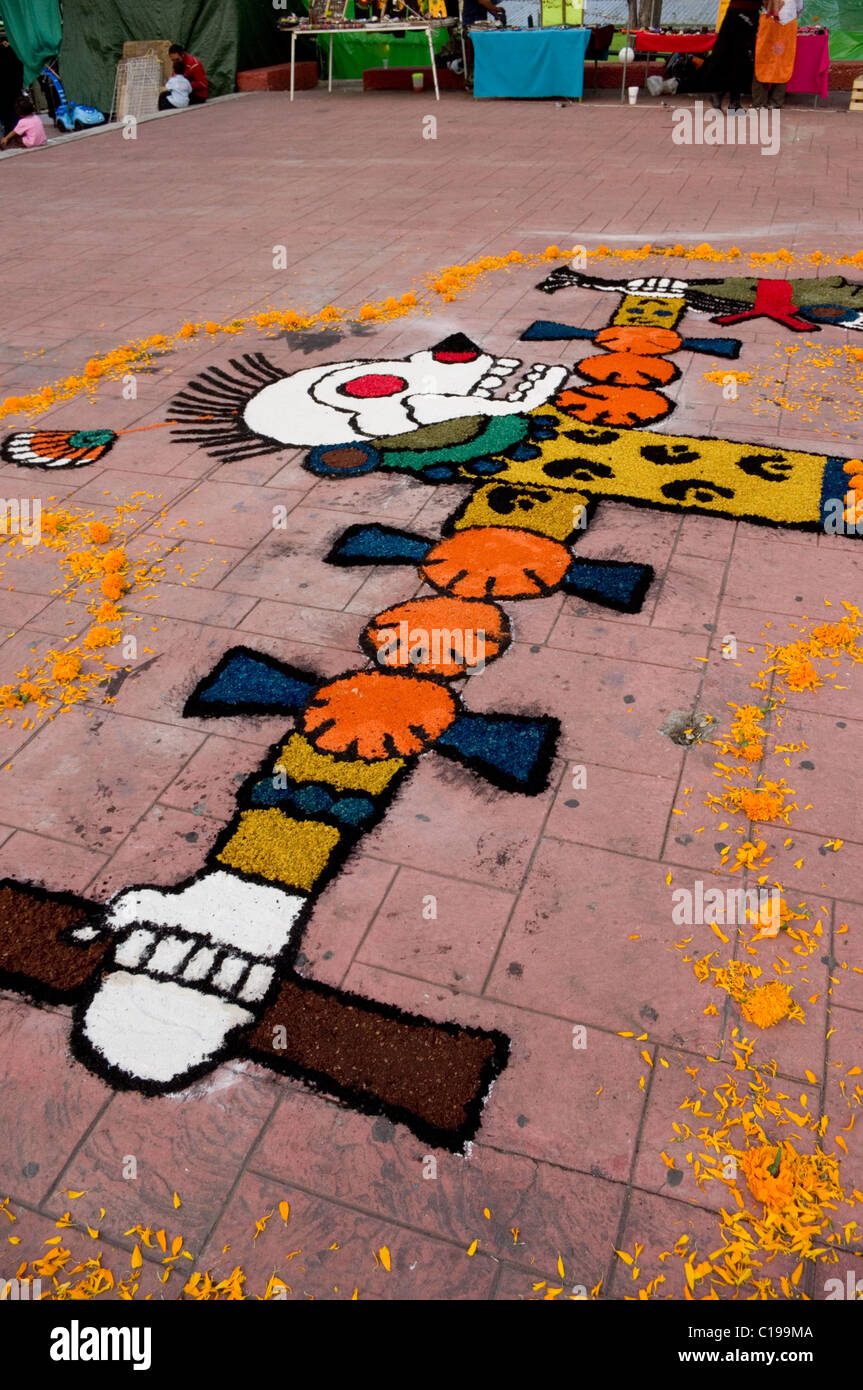 Drawing made with colored sand and flowers representing an Aztec ...