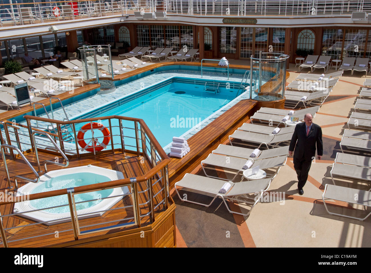President and Managing Director of Cunard Peter Shanks walks past one ...