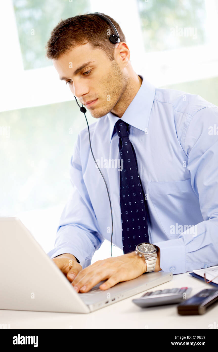 Young business man working in the office Stock Photo - Alamy