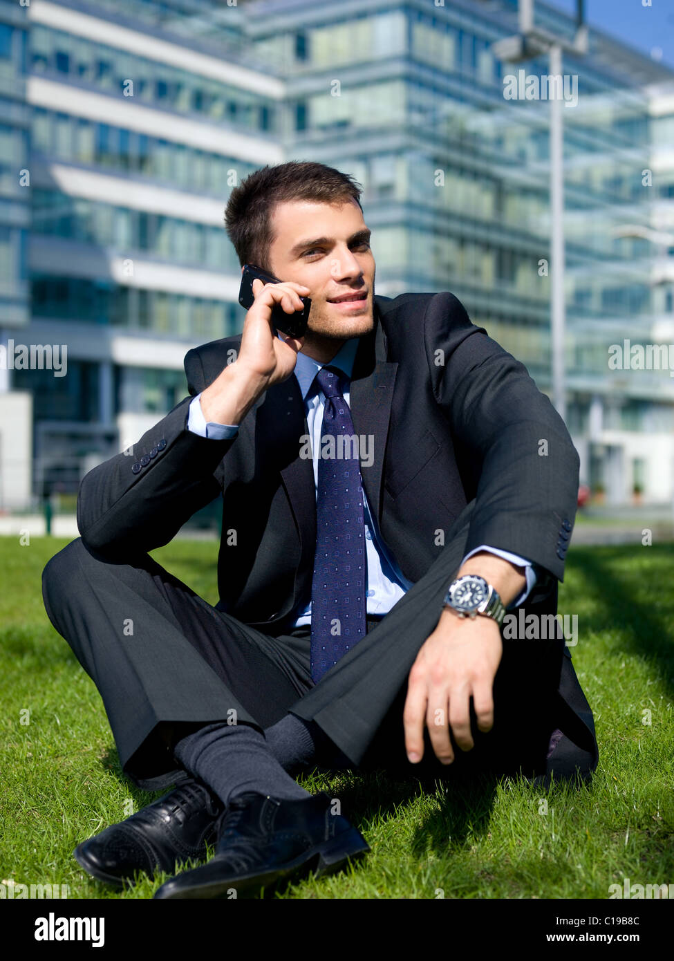 Portrait of business man outside the building Stock Photo - Alamy