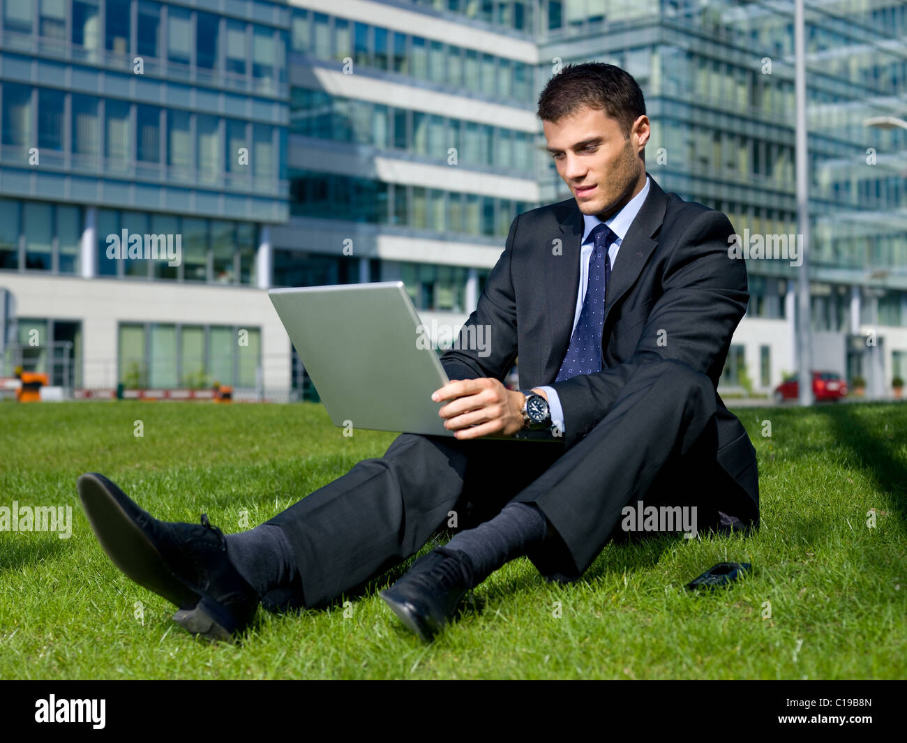 Portrait of business man outside the building Stock Photo - Alamy