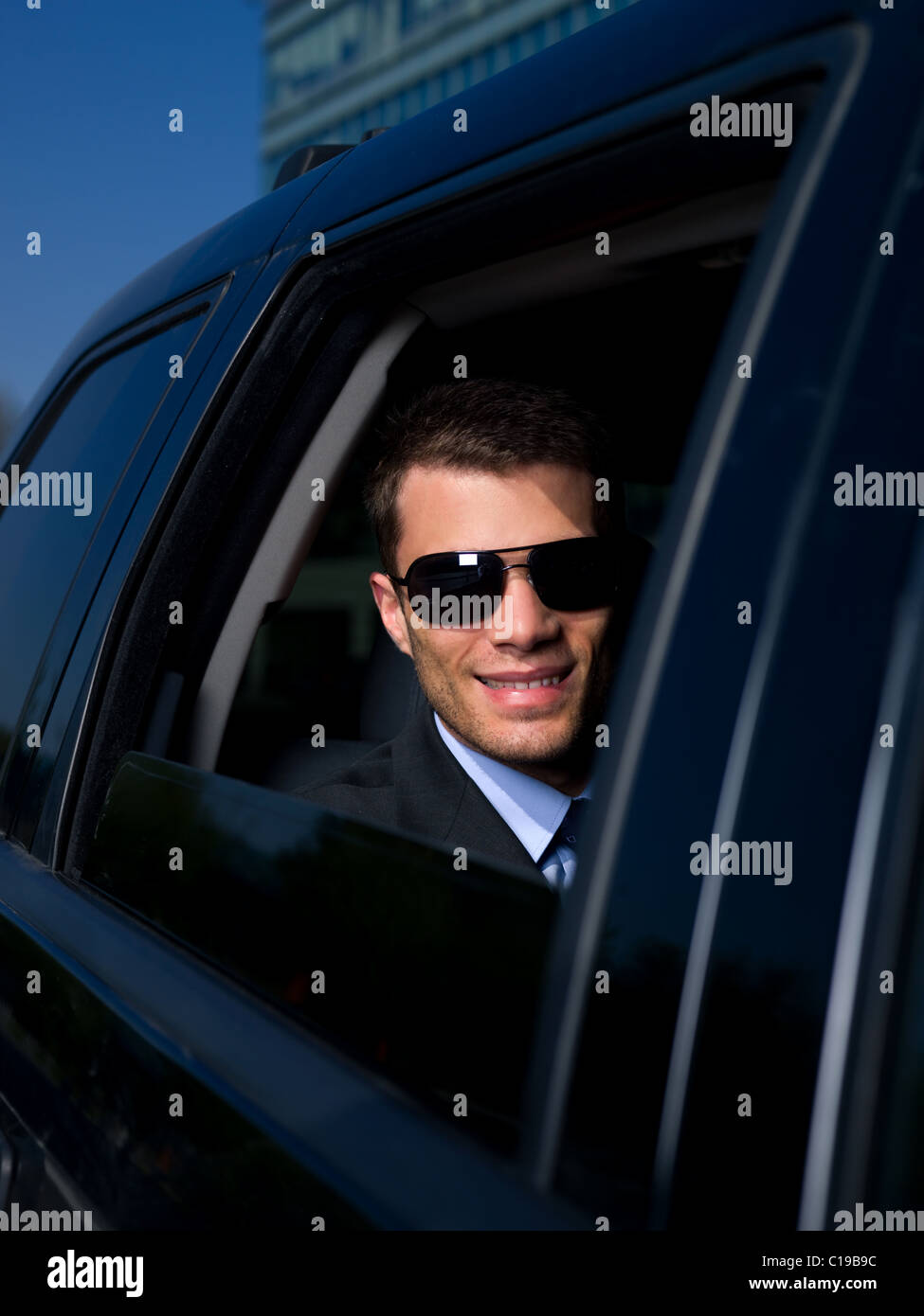 Portrait of business man outside the building Stock Photo - Alamy