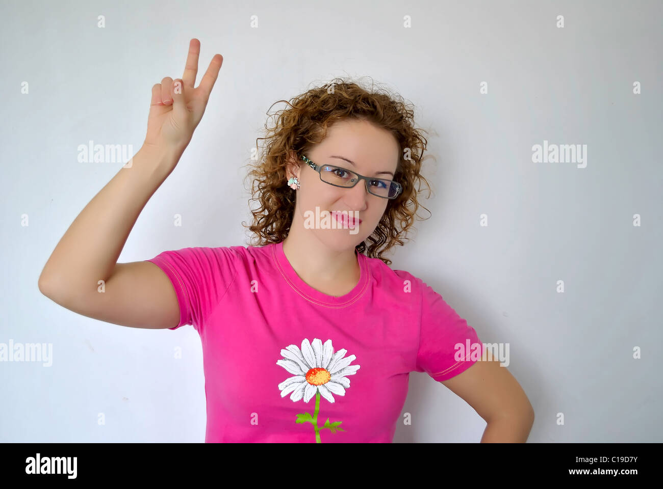 Women shows victory sign Stock Photo - Alamy