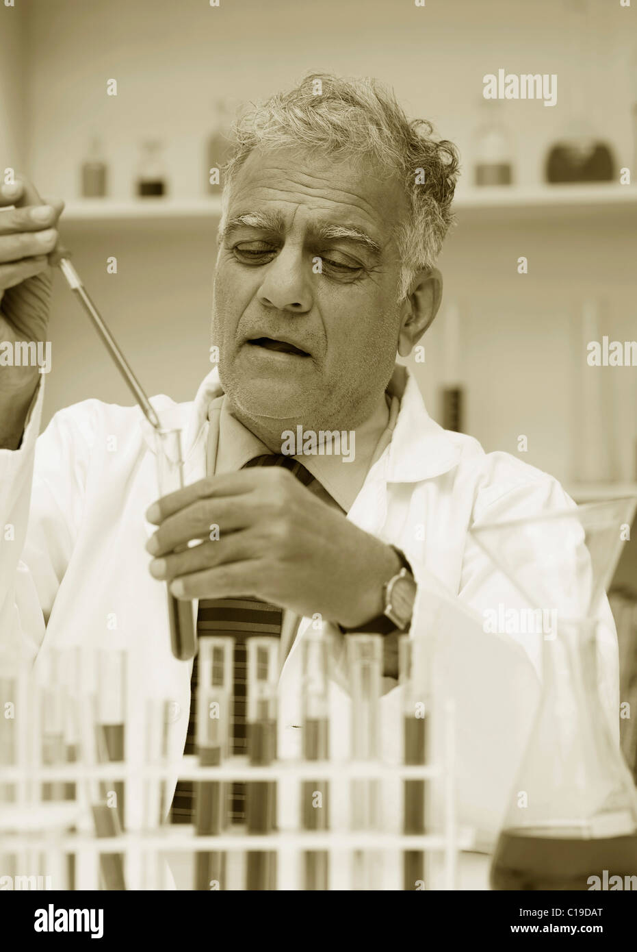 Scientist doing scientific experiment in a laboratory Stock Photo - Alamy
