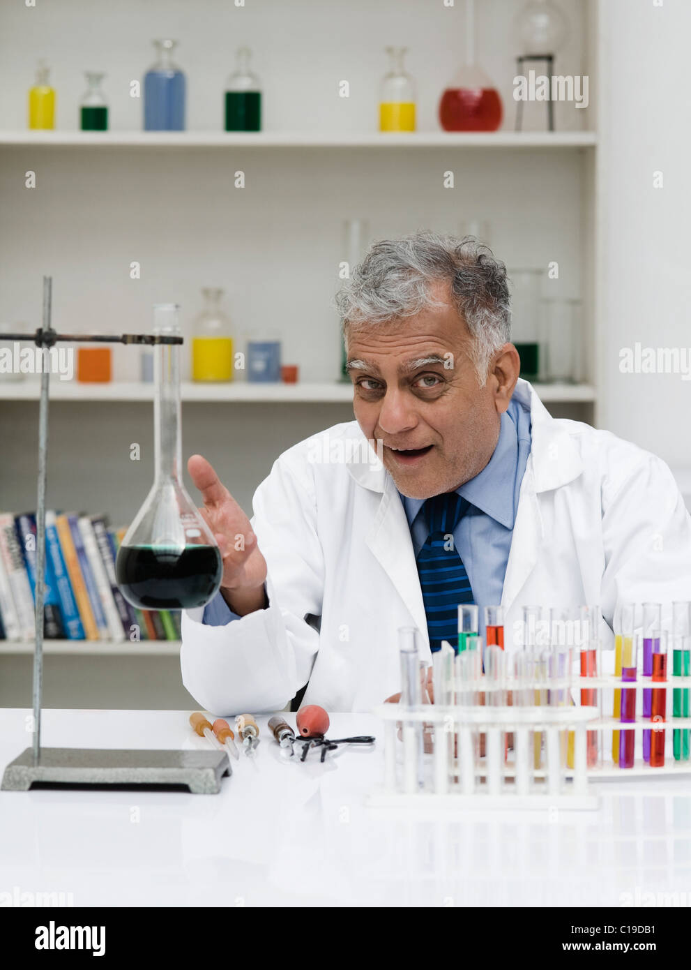 Scientist doing scientific experiment in a laboratory Stock Photo - Alamy