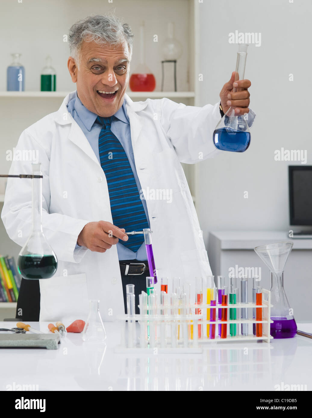 Scientist doing scientific experiment in a laboratory Stock Photo - Alamy