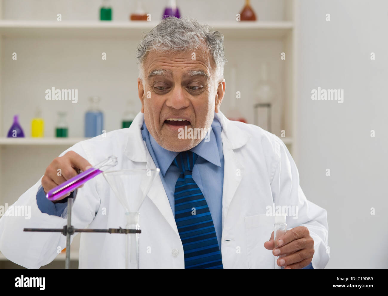 Scientist doing scientific experiment in a laboratory Stock Photo - Alamy