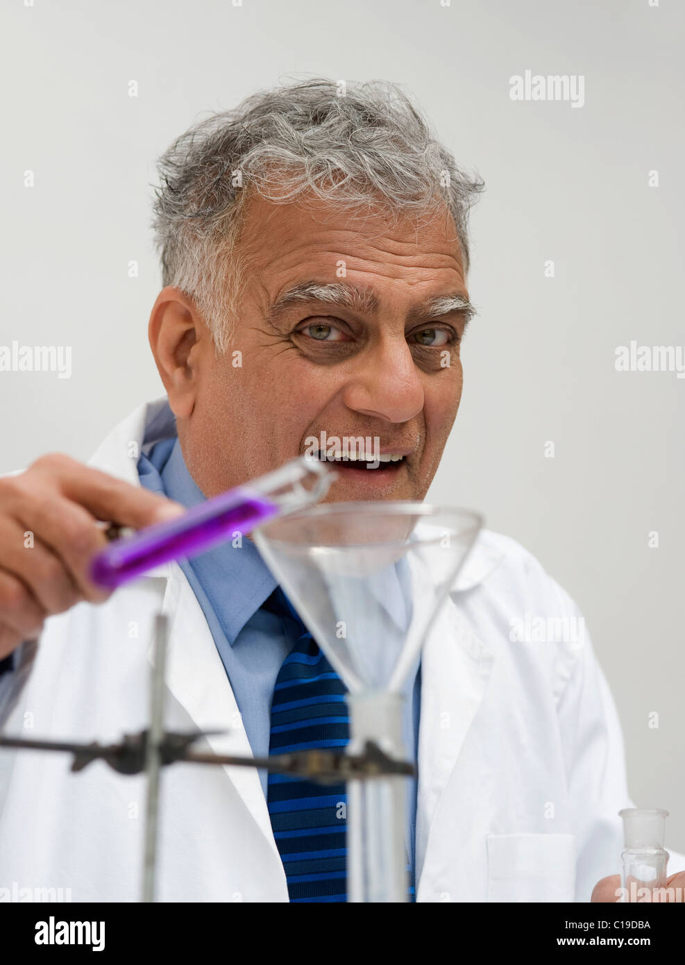Scientist doing scientific experiment in a laboratory Stock Photo - Alamy