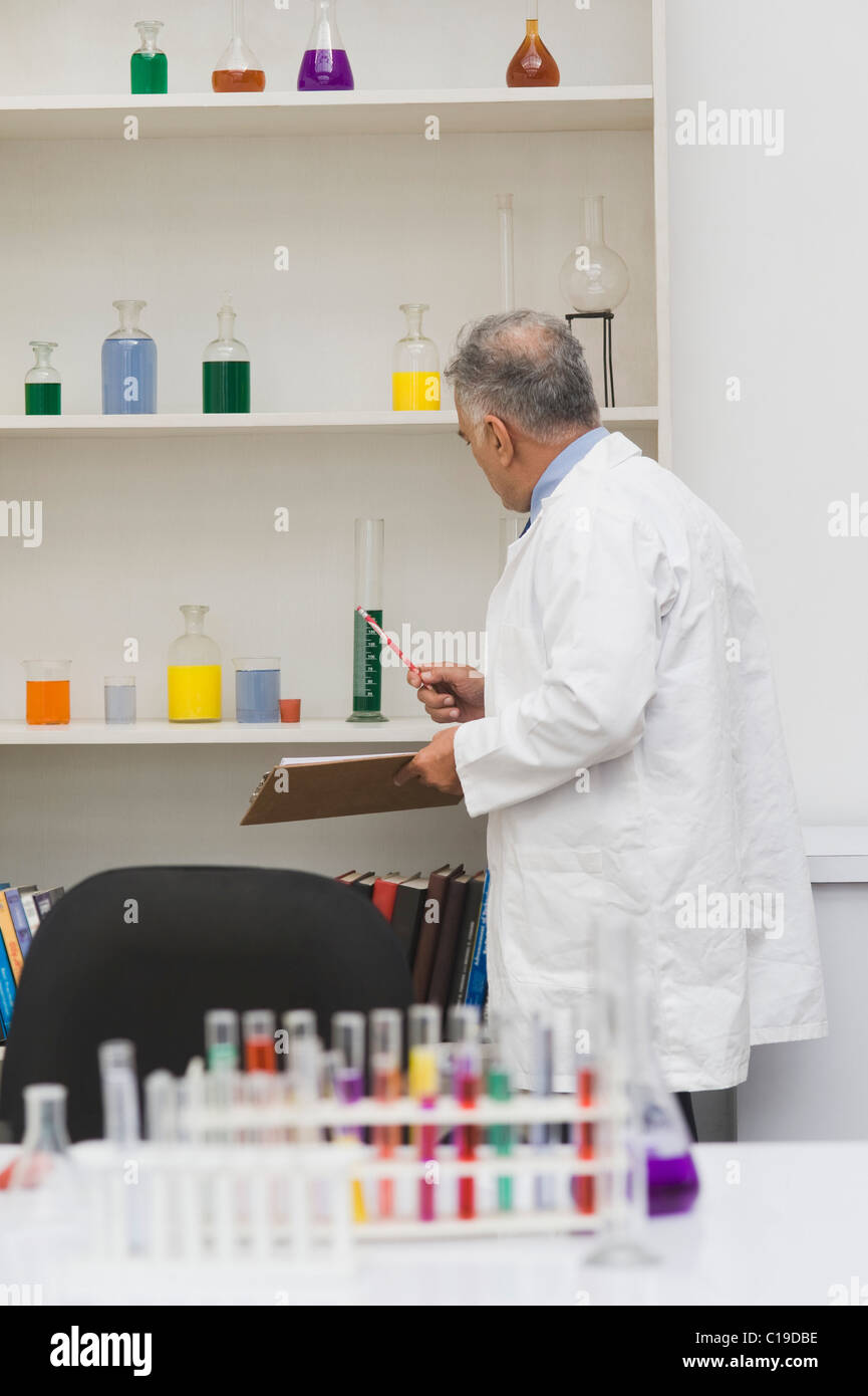 Scientist doing scientific experiment in a laboratory Stock Photo - Alamy