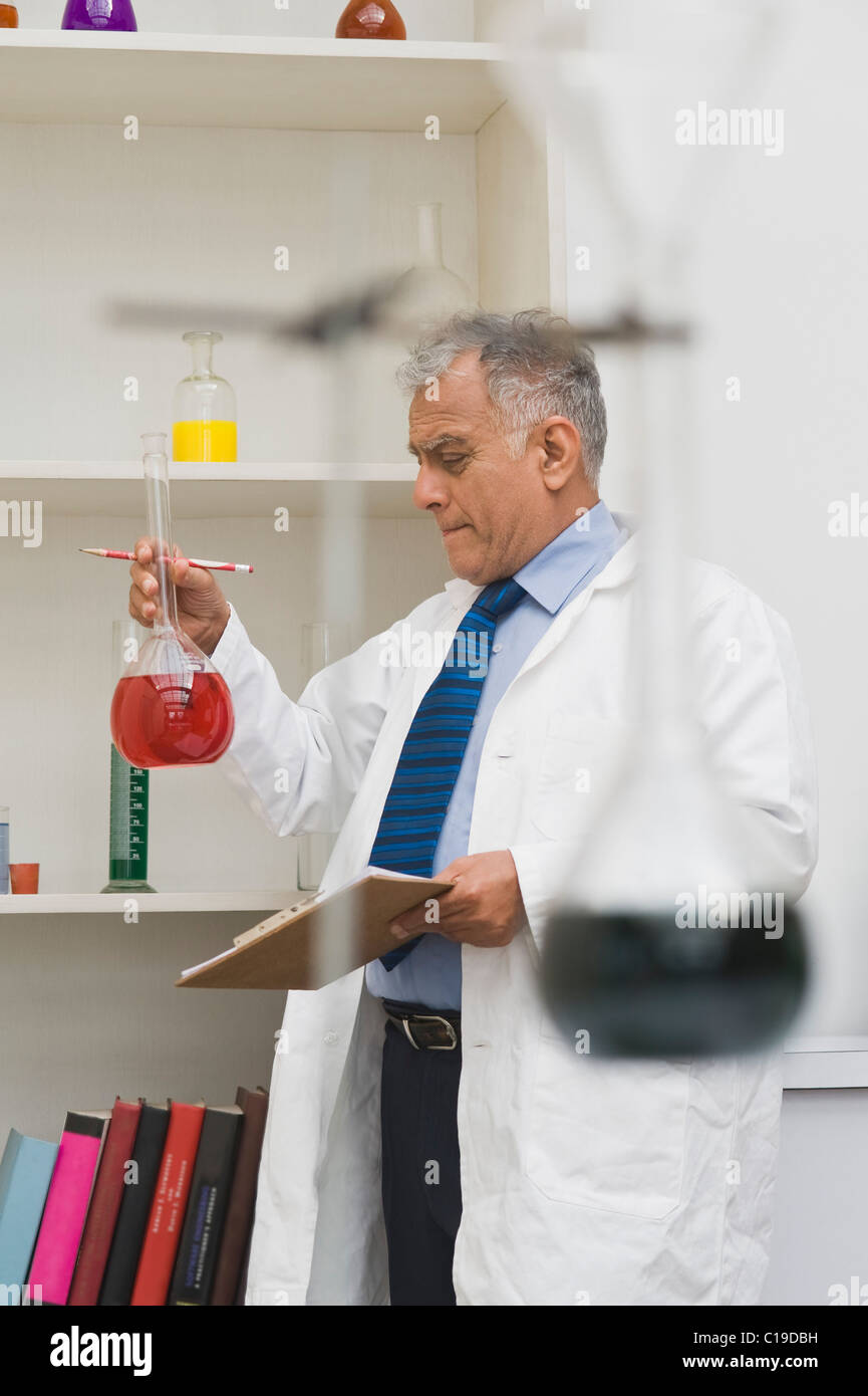 Scientist doing scientific experiment in a laboratory Stock Photo - Alamy