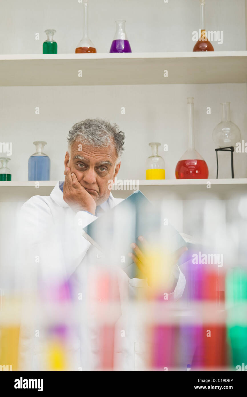 Male scientist hand on chin hi-res stock photography and images - Alamy