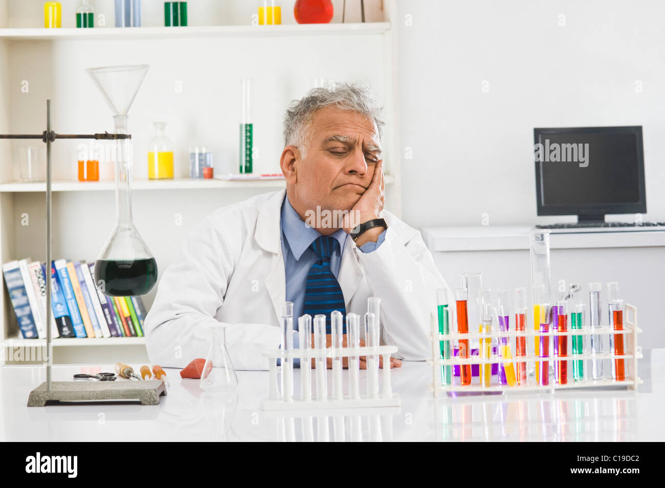 Scientist looking tired in a laboratory Stock Photo - Alamy
