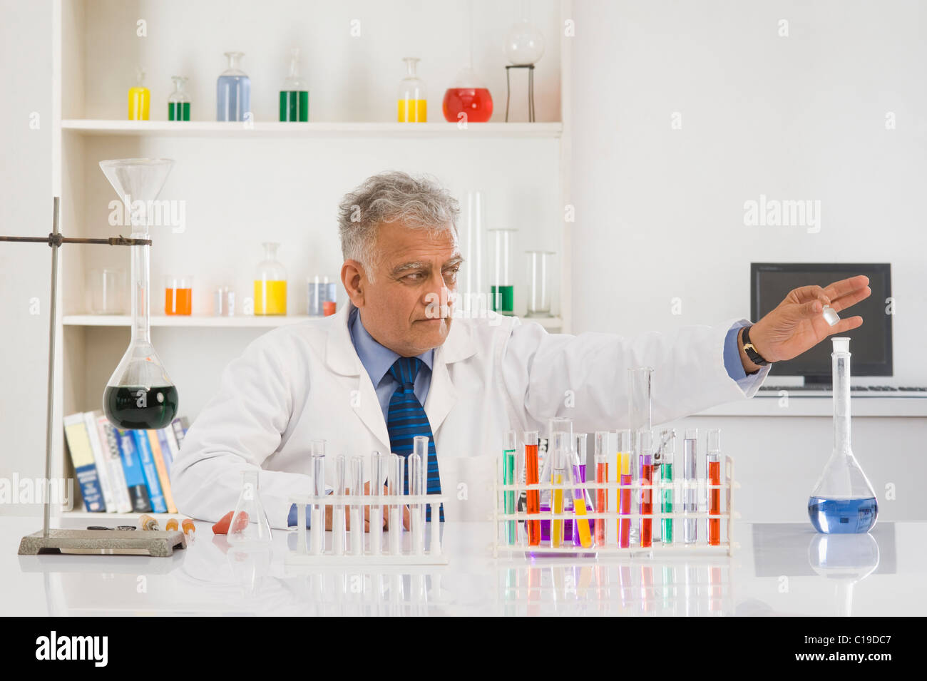 Scientist doing scientific experiment in a laboratory Stock Photo - Alamy