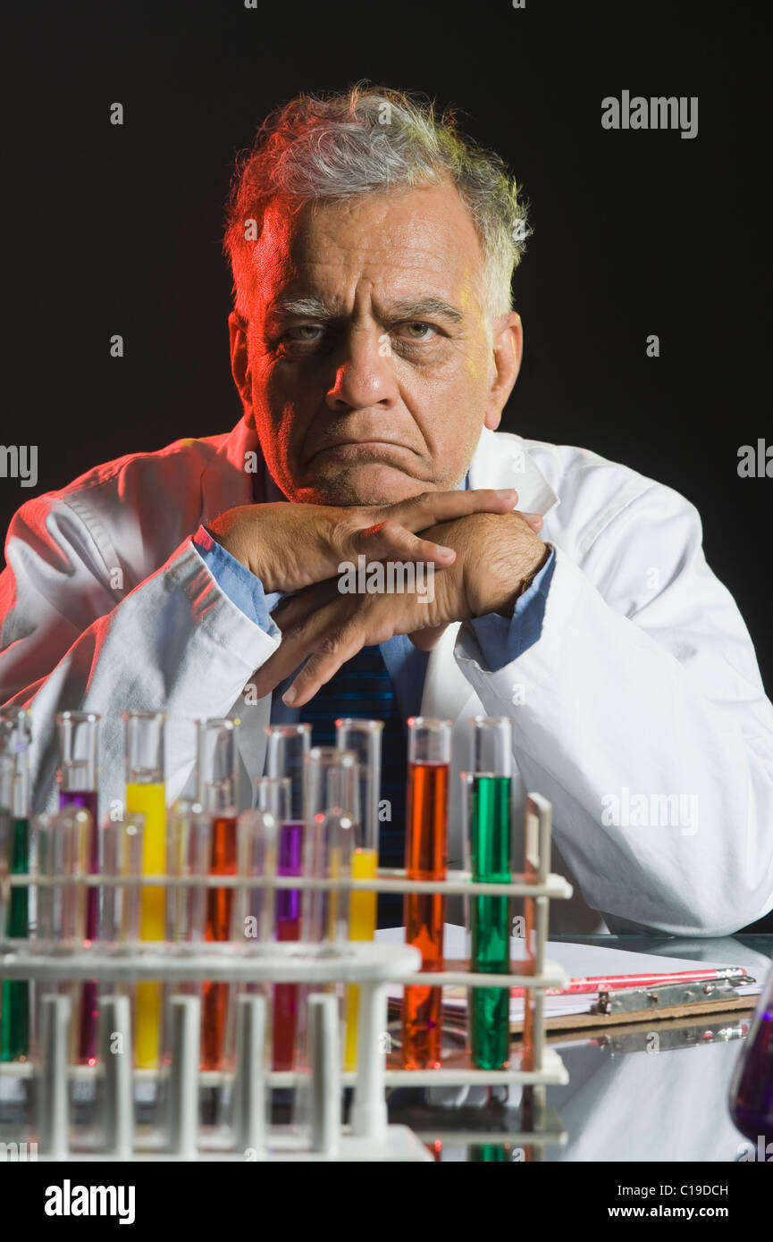 Scientist with test tubes in a laboratory Stock Photo - Alamy