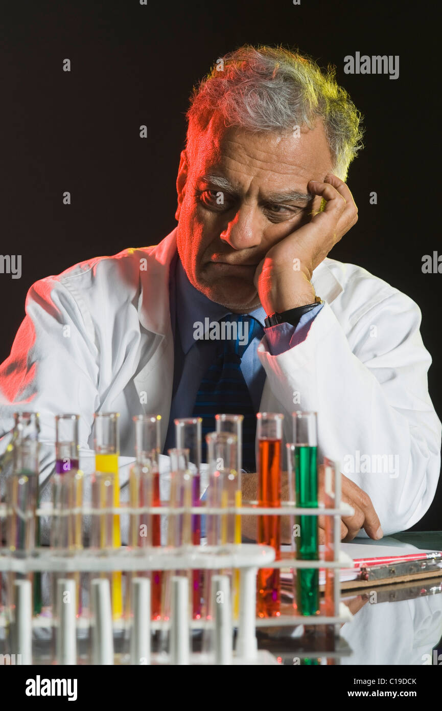 Scientist with test tubes in a laboratory Stock Photo - Alamy