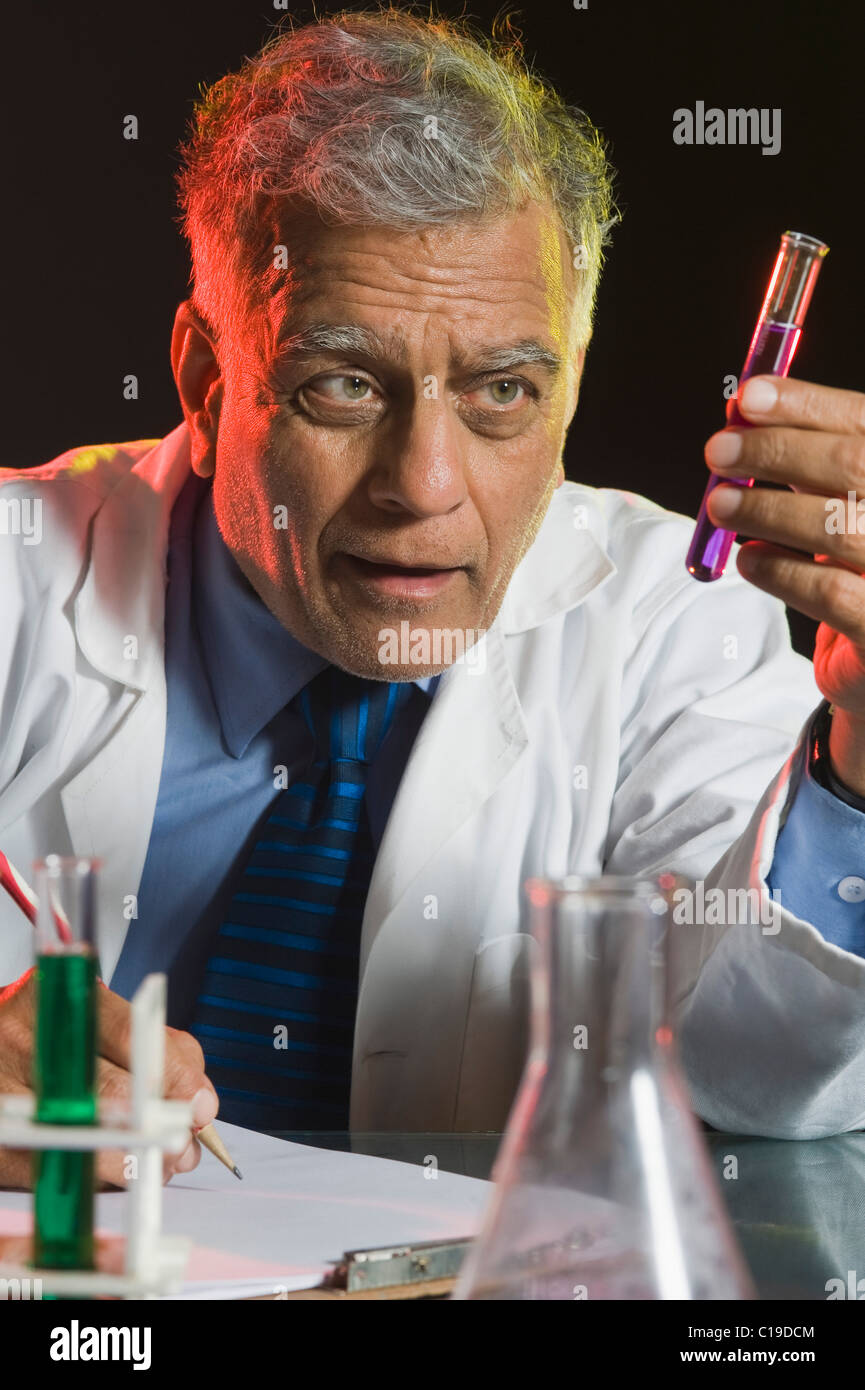 Scientist doing scientific experiment in a laboratory Stock Photo - Alamy