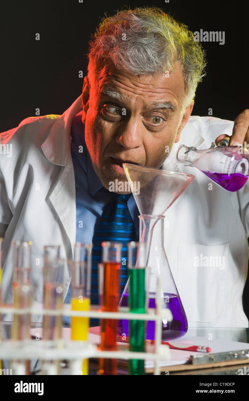 Scientist doing scientific experiment in a laboratory Stock Photo - Alamy