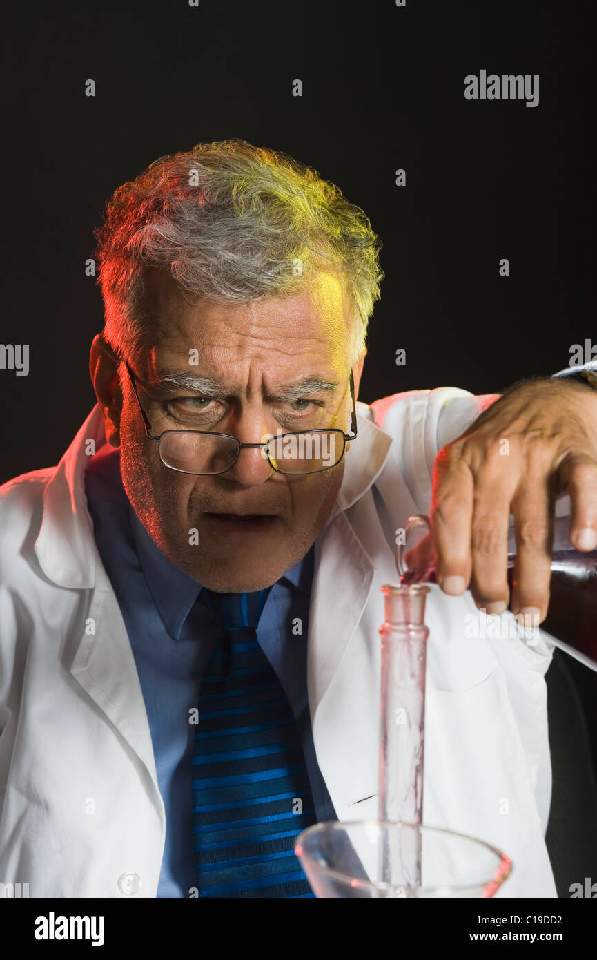 Scientist doing scientific experiment in a laboratory Stock Photo - Alamy