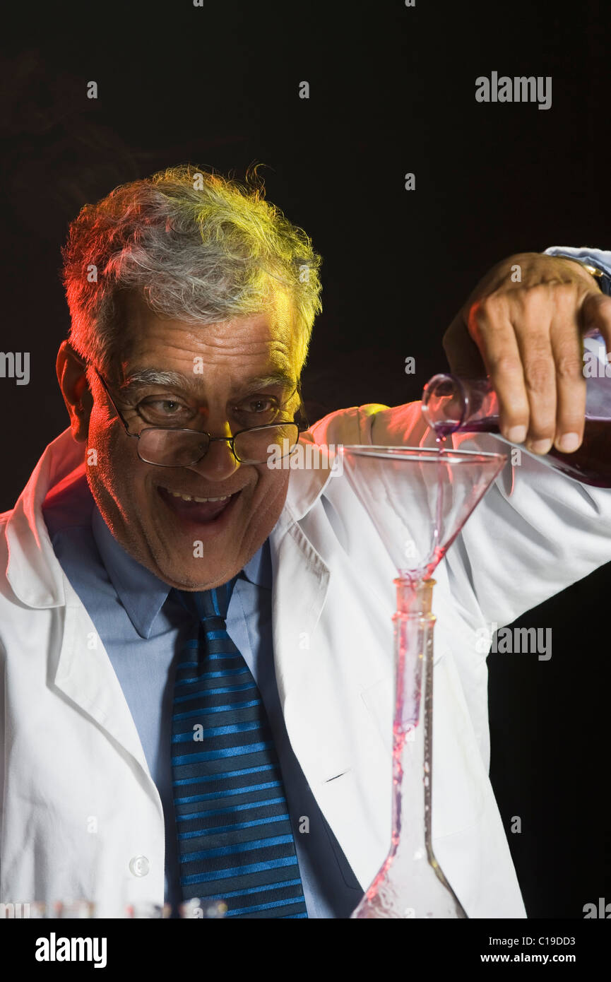 Scientist doing scientific experiment in a laboratory Stock Photo - Alamy