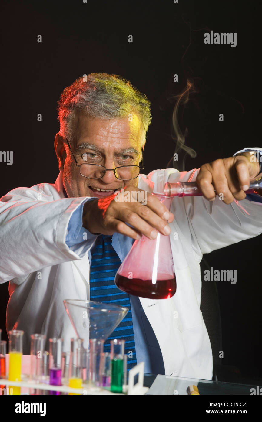Scientist doing scientific experiment in a laboratory Stock Photo - Alamy