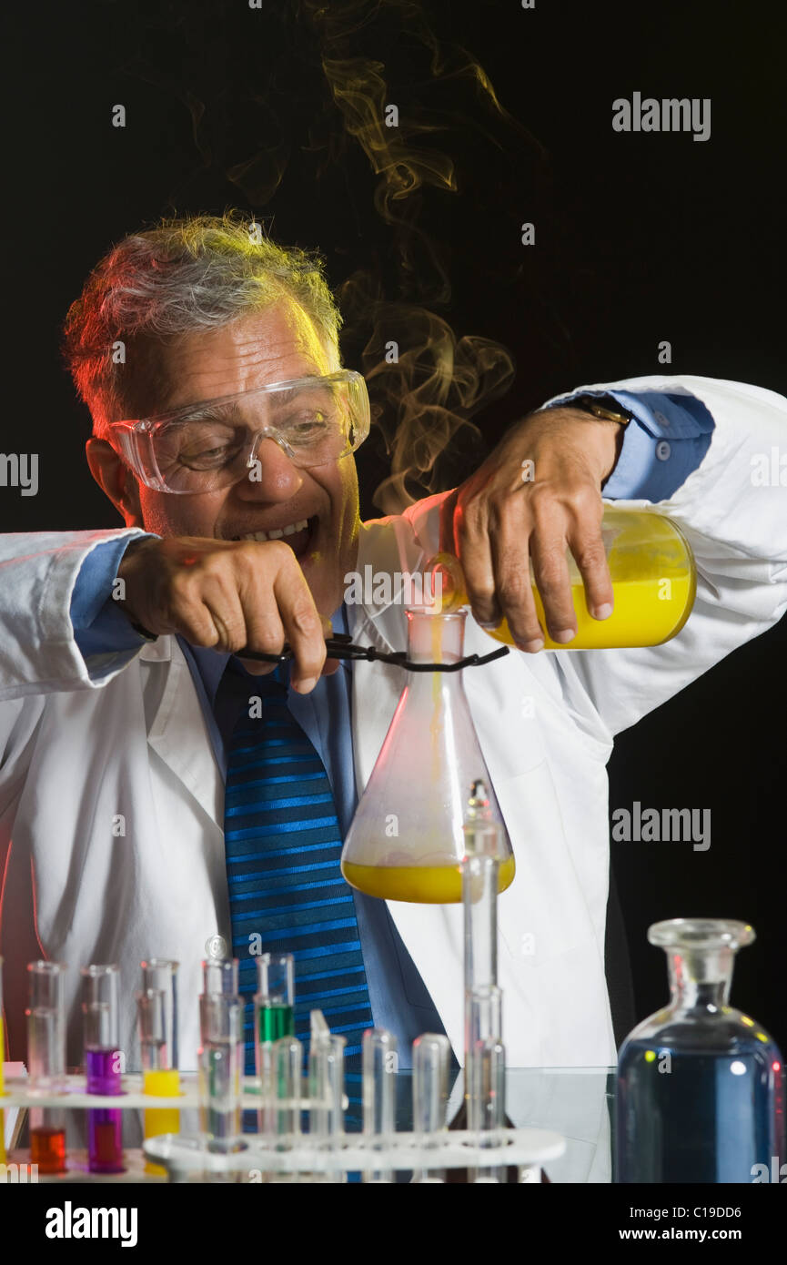 Scientist doing scientific experiment in a laboratory Stock Photo - Alamy