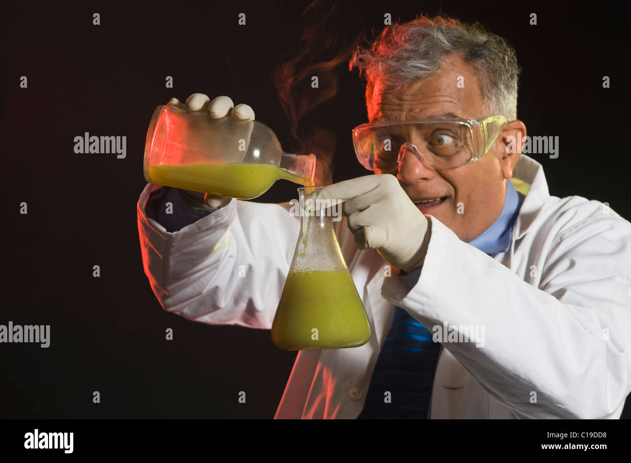 Scientist doing scientific experiment in a laboratory Stock Photo - Alamy