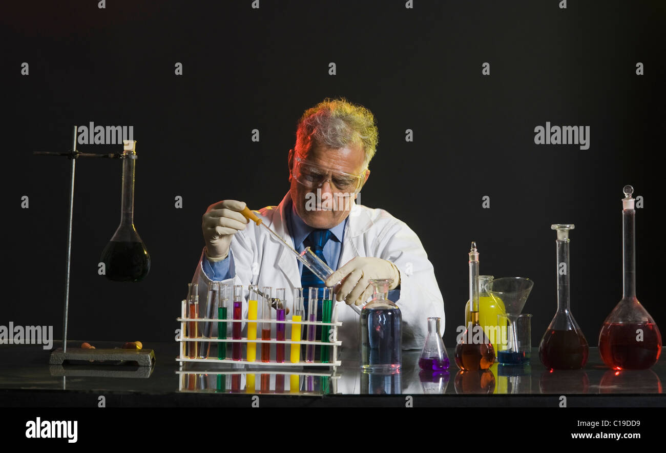Scientist doing scientific experiment in a laboratory Stock Photo - Alamy