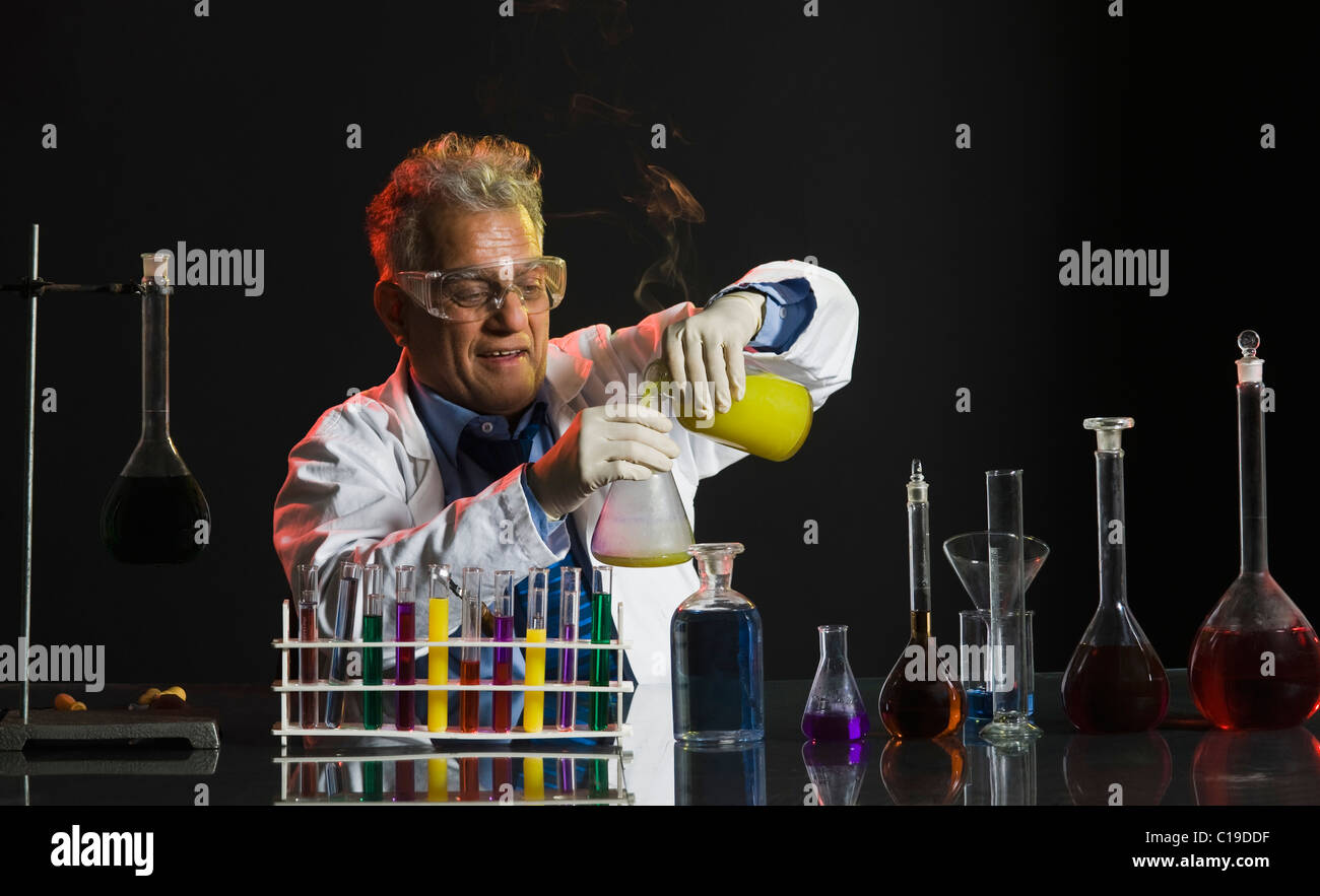 Scientist doing scientific experiment in a laboratory Stock Photo - Alamy