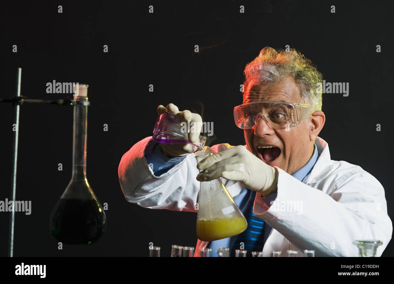 Scientist doing scientific experiment in a laboratory Stock Photo - Alamy