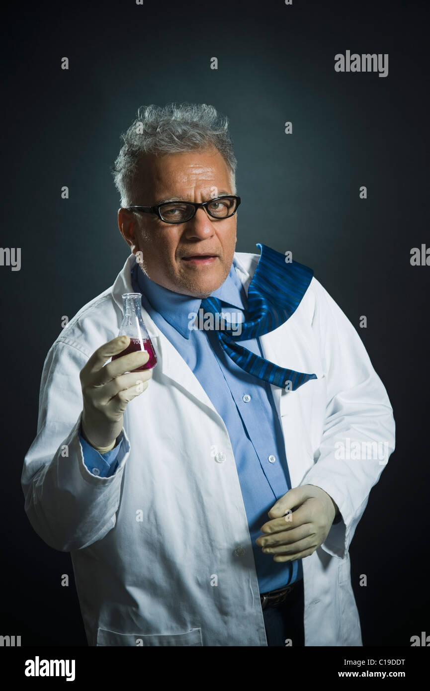 Scientist holding a chemical flask Stock Photo - Alamy