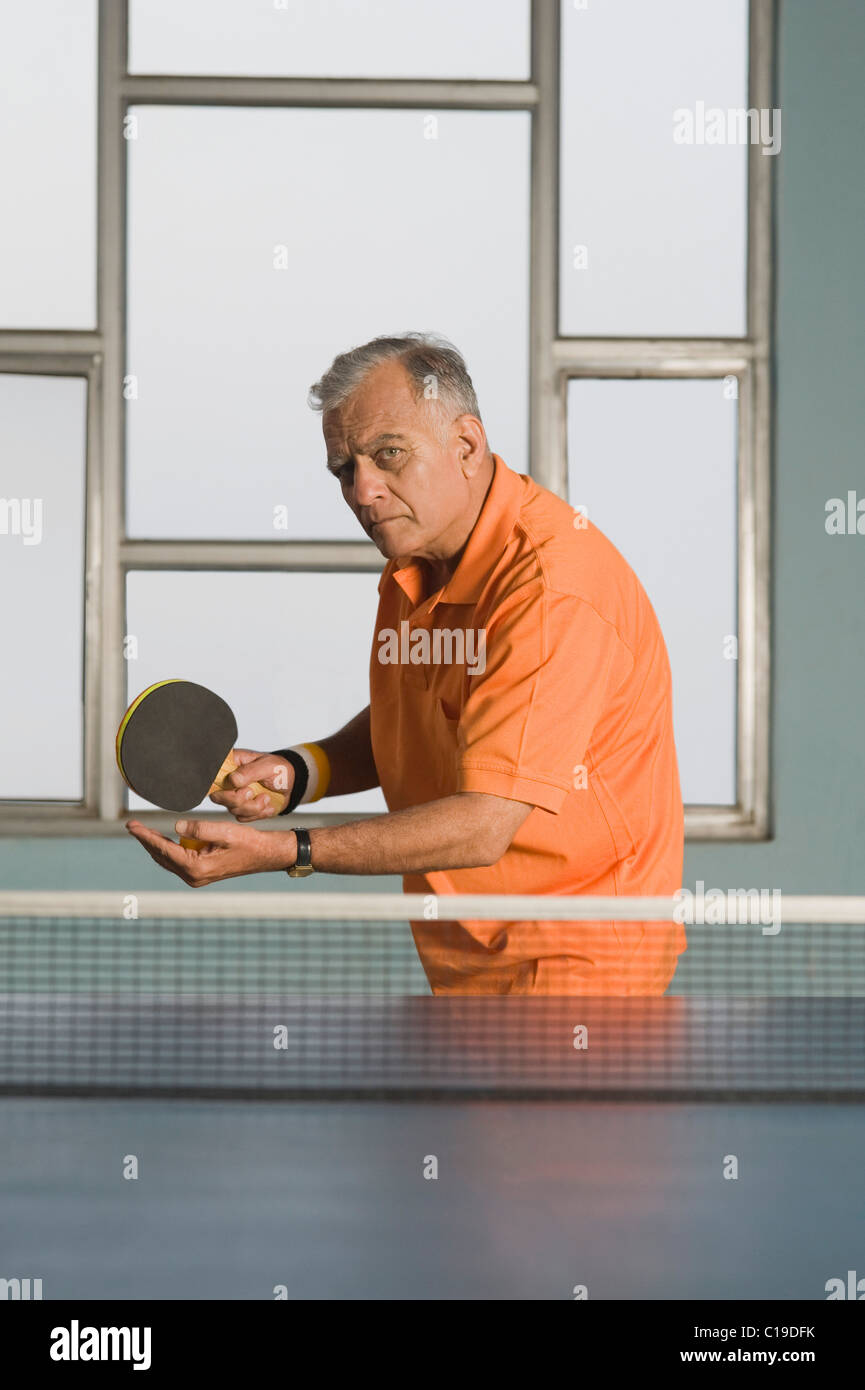 Man playing table tennis Stock Photo - Alamy