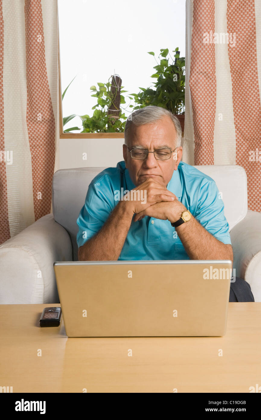 Man using a laptop Stock Photo - Alamy