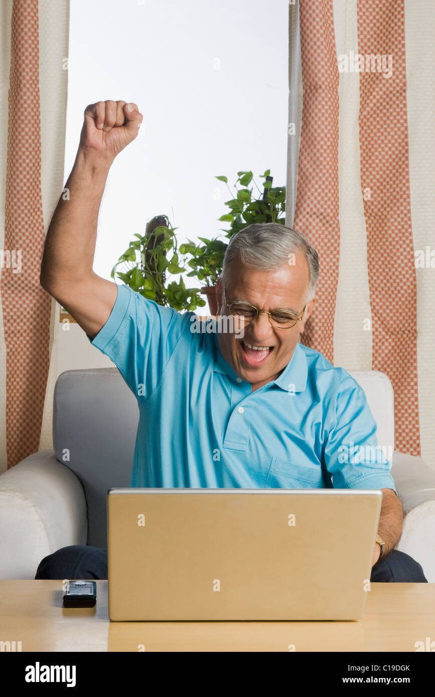 Man using a laptop Stock Photo - Alamy