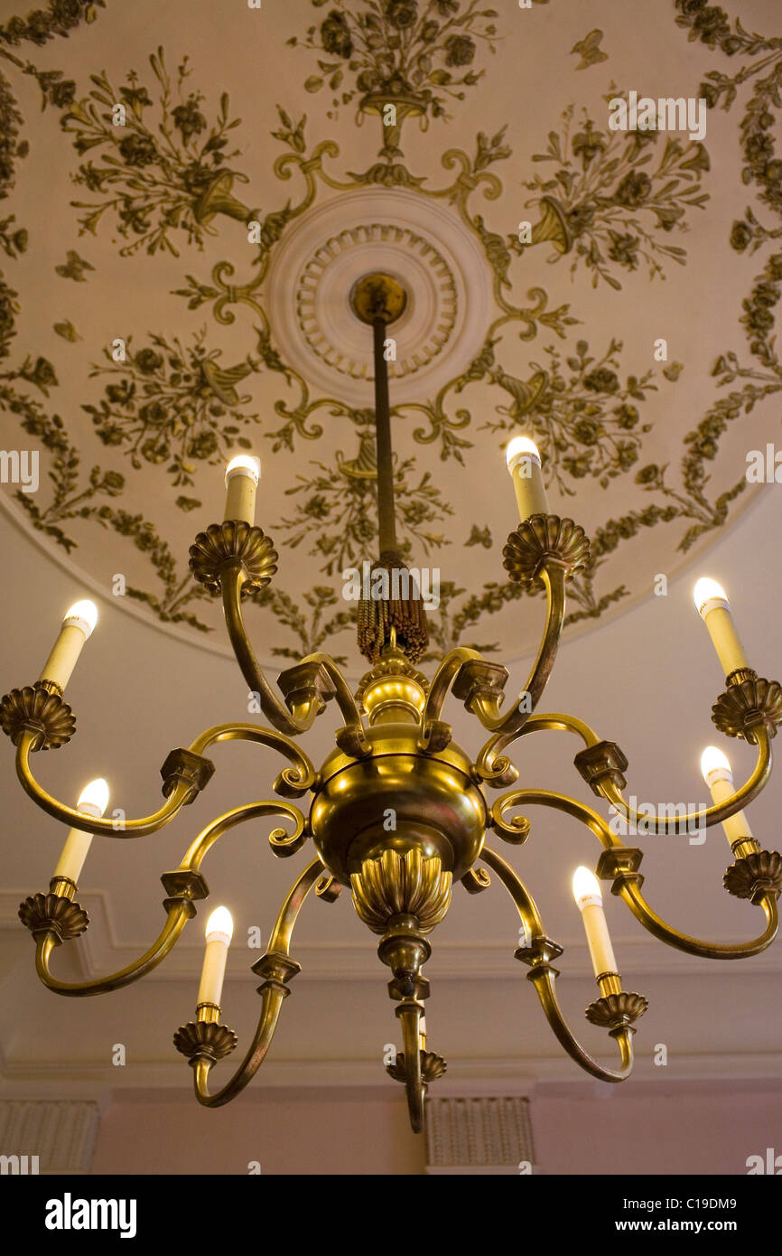 A chandelier with candle themed lights Stock Photo - Alamy